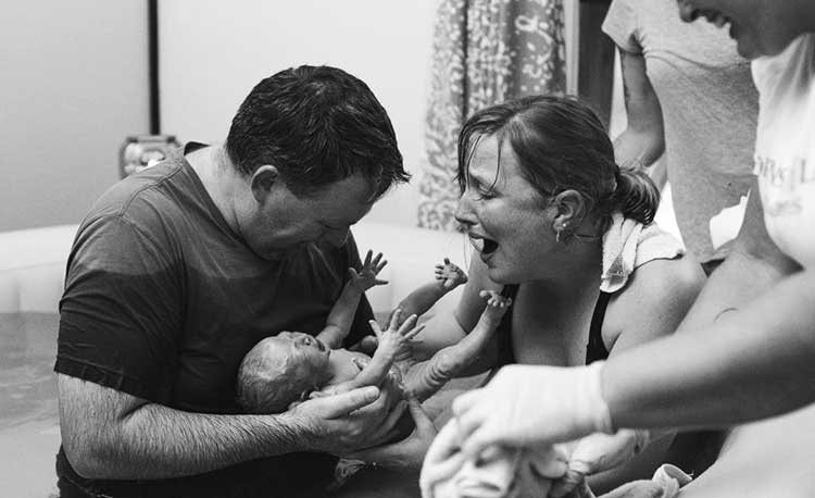 A Woman Giving Birth - Smile Is Giving Birth To Her Child!